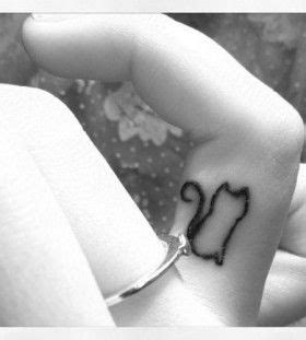 Adorable Pretty Cat Tattoo On Finger › Tattoo Designs