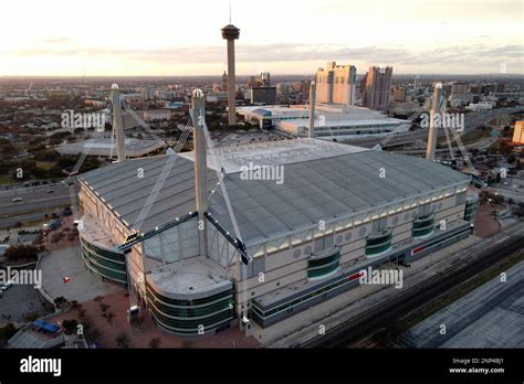 An Aerial View Of The Alamodome With The Tower Of The Americas And