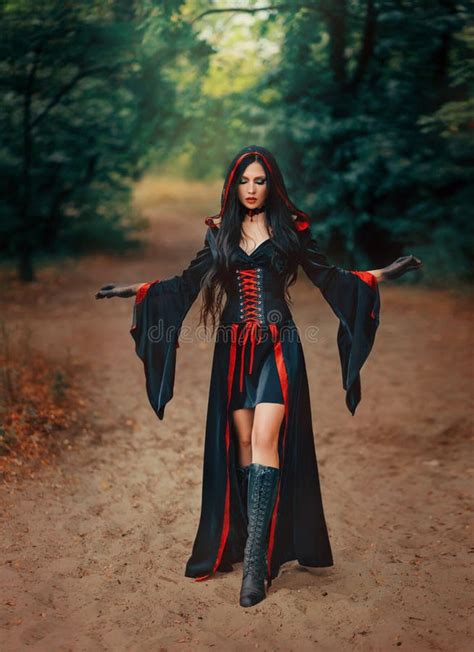 Fantasy Halloween Woman Witch Walks In Summer Nature Green Forest Trees