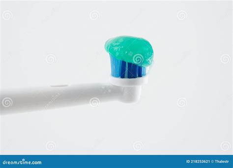 Generic Automatic Toothbrush Head With Green Toothpaste On Blue