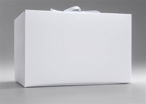 Two White Boxes With Bows Premium Ai Generated Image