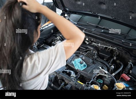 Asian Woman Having Problems With Her Car Beautiful Woman Inspecting Broken Car Before Leaving