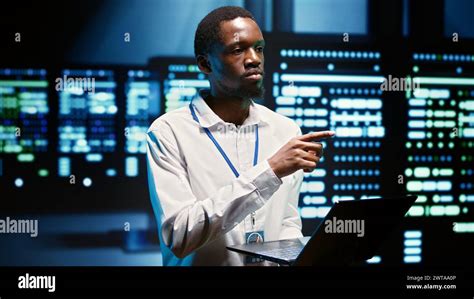 System Administrator Ensuring Data Center Servers Are Properly Equipped