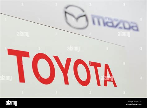 Logos Of Toyota Motor Corporation And Mazda Motor Corporation On