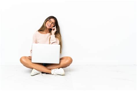 Premium Photo Young Woman With A Laptop Sitting On The Floor Isolated