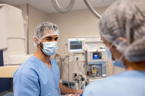 Surgeons Talking In The Hemodynamics Room While Performing A Medical