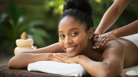 Premium Photo Beautiful African Woman Smiling Enjoying Massage In Spa