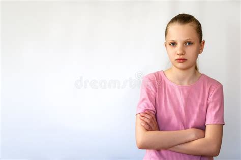 Upset Girl Standing With Arms Crossed Indoors Serious Young Girl In