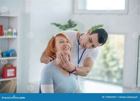 Positive Elderly Woman Enjoying The Massage Procedure Stock Image