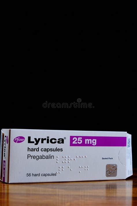 Pregabalin Rx Medical Pills In Plactic Bottle With Tablets Pills Spilling Out From Yellow