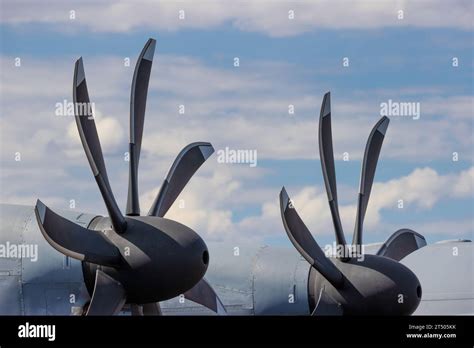 Close Up Of Tow Propeller Driven Engines Under Cloudy Skies In This