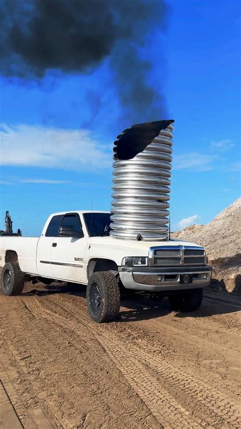 Jacked Up Dodge Trucks With Stacks