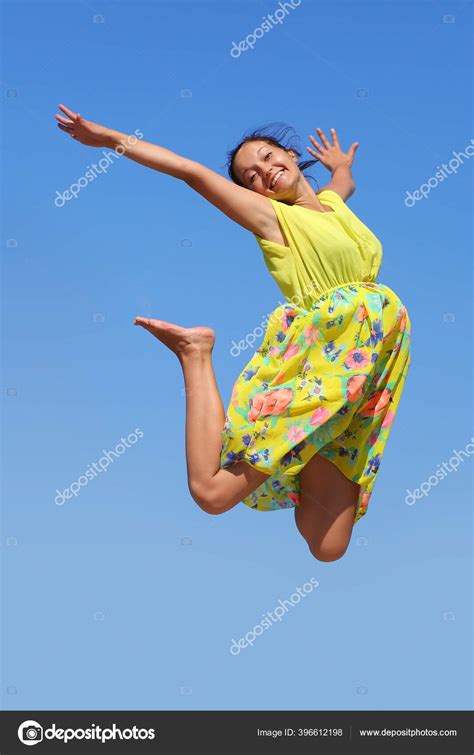Woman Jumping In Dress
