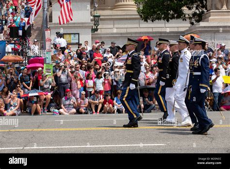 Members Of The Military March In Th 4th Of July Parade On Constitution