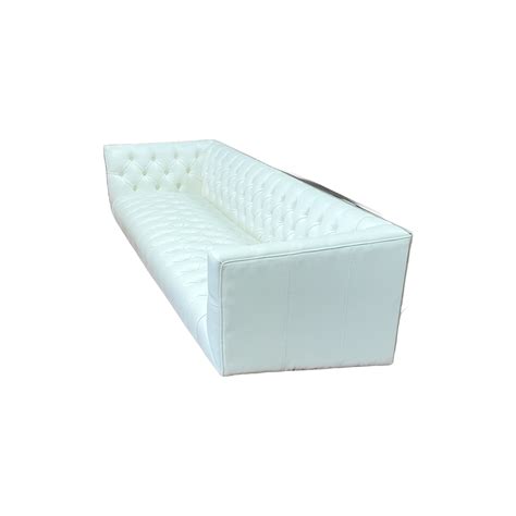 Designer White Leather Tufted Sofa With Chrome Trim And Feet