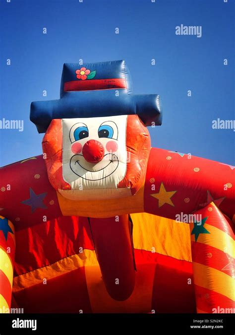 The Large Face Of A Clown Part Of A Bouncy Castle At An English