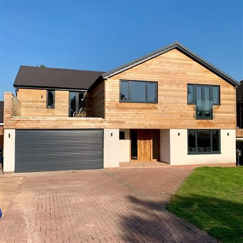 Modern House Exterior With White Render Cedar Wood Cladding
