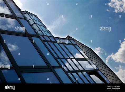 Sky And Mirror Image Of The Sky In A Glass Cladding Germany North