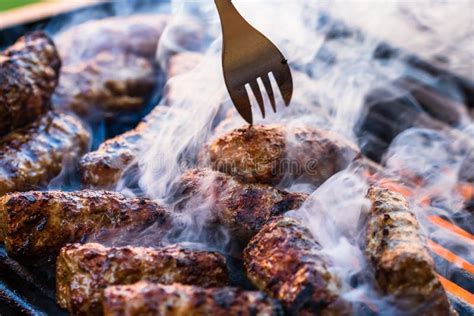 Preparing Meat Rolls Called Mici Or Mititei On Barbecue Close Up Of