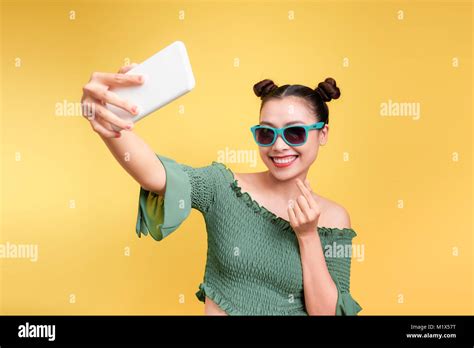 Young Cheerful Attractive Asian Woman Taking Selfies With Smile Stock