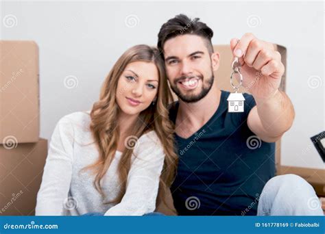 Young Couple Holding Their New House Keys Stock Image Image Of Home