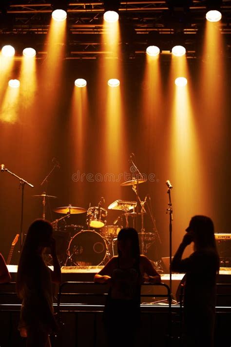 Silhouette Band And Playing At Stage For Concert Spotlight And