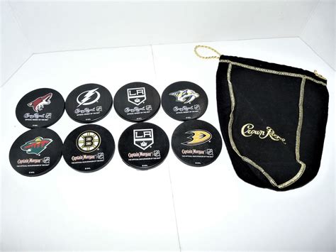 Crown Royal Captain Morgan Hockey Puck Coasters Black Crown Royal Bag Bodnarus Auctioneering