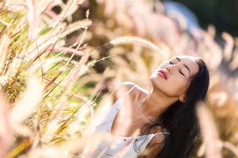 Fashion Close Up Portrait Of Young Asian Girl Posing Near To Showcase