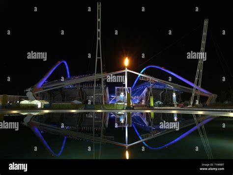 The Olympic Stadium Reflected In Water At Night During The 2004 Athens