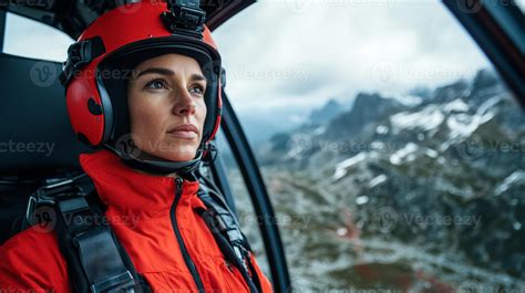 Female Helicopter Search And Rescue Pilot Flying Over Rugged