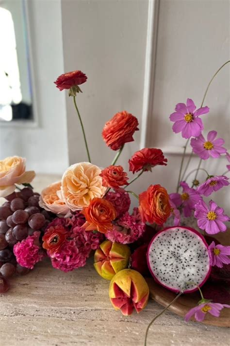Floral Arrangement With Fruit And Flowers Vibrant Wedding Floral
