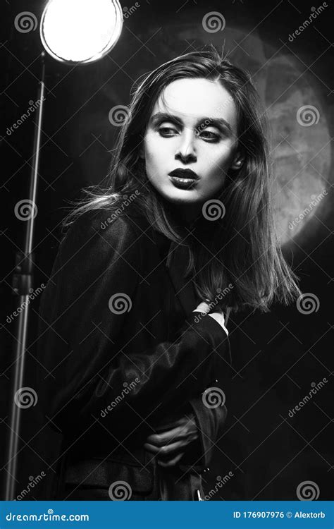 Beautiful Slim Girl Model With Red Lips Wearing A Black Blazer