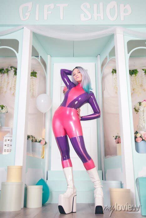 Pretty Anime Girl Wearing Latex Rubber Doll Catsuit And Posing Posters