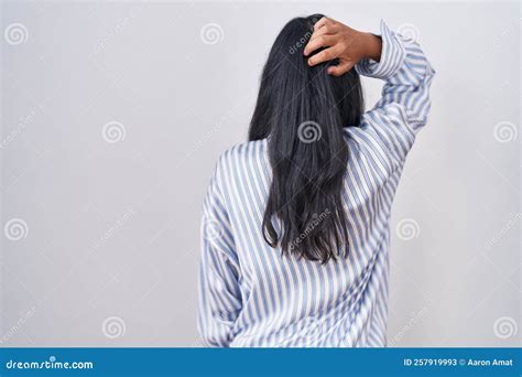 Young Hispanic Woman Wearing Glasses Backwards Thinking About Doubt