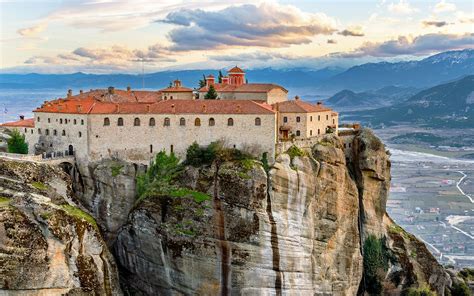Rousanou Monastery Flowered Paths And Cliffside Views