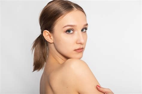 Premium Photo Beautiful Young Woman With Clean Fresh Skin Look Away