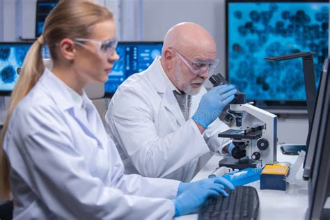 Professor And His Young And Professional Laboratory Assistant Are Doing