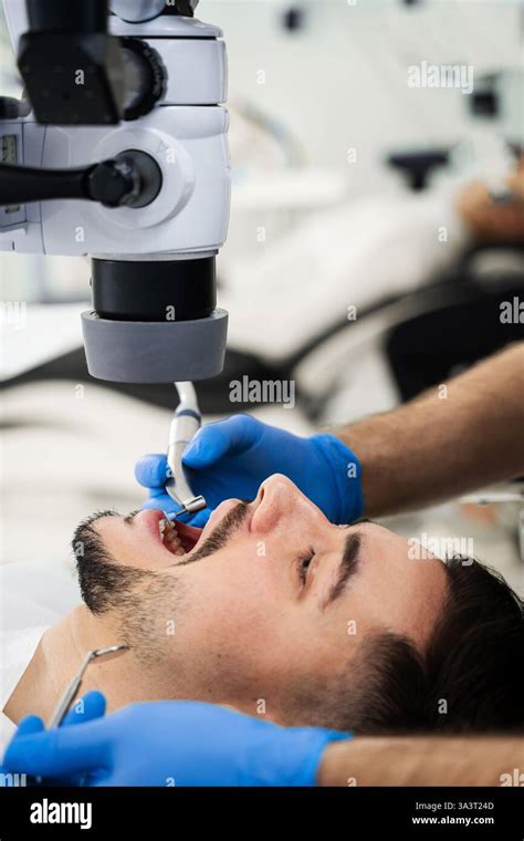 Polishing Teeth Under A Digital Microscope Process Dentist Uses Dental Polisher Hardware And