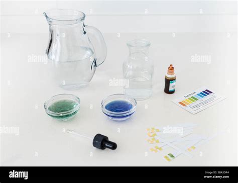 Photographs Of A Water Ph Testing Kit Including Color Indicator Drops And A Comparison Chart