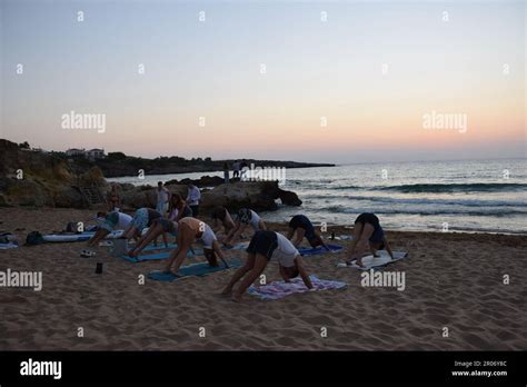 Yoga On The Beach In Greece Tyoga Retreat Group Yoga Class On The