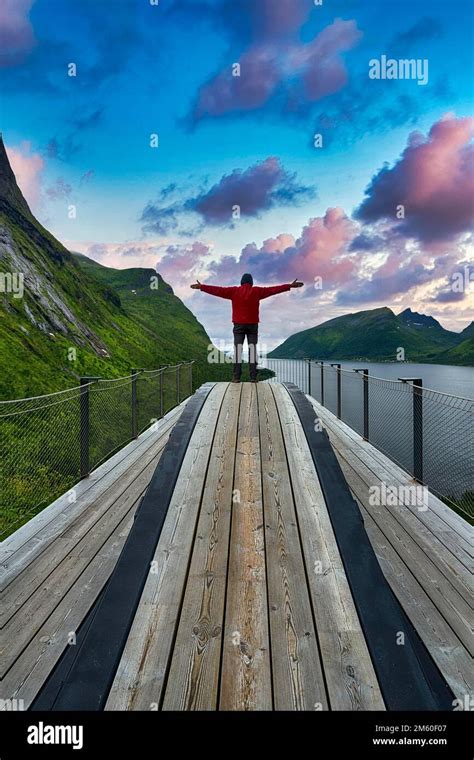 Tourist Standing On Viewing Platform Bergsbotn Arms Outstretched