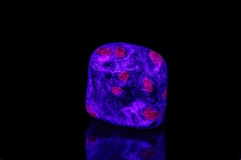 Premium Photo Macro Mineral Stone Ruby Under Ultraviolet Light On A Black Background