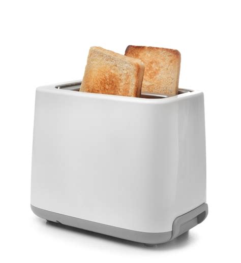 Premium Photo Slices Of Bread In Toaster Against White Background