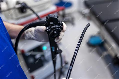 Premium Photo Doctor Proctologist Holding Endoscope During