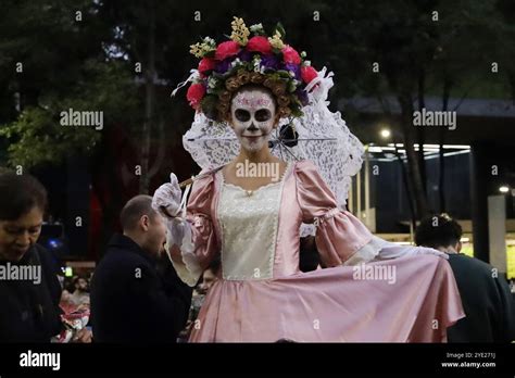 Non Exclusive A Woman Dressed As Catrinas With Her Face Made Up As