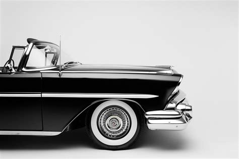 Restored Vintage Car On Plain White Background Emphasizing Timeless