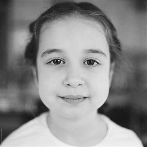 Black And White Close Up Portrait Of A Young Girl With Big Cheeks By