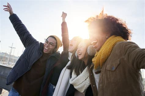 Group Of Excited Young Friends Having Fun Together Outdoor Diverse