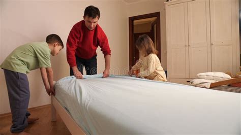 Father And Son Making A Bed Stock Video Video Of Fatherhood