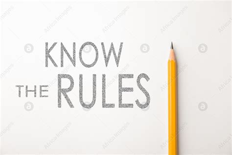 Phrase Know The Rules And Pencil On White Background Top View Stock